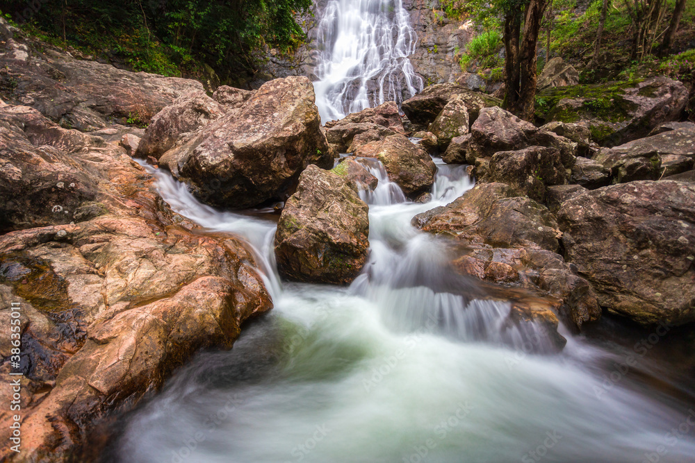 Beautiful natural Sarika waterfall with rocks in the foreground at Khao ...