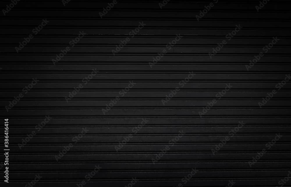 grunge black steel shutter door background and texture with vignette ...