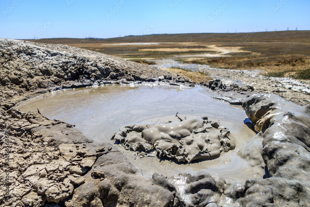 Gas bubble during its explode inside crater of mud volcano. Shot in ...