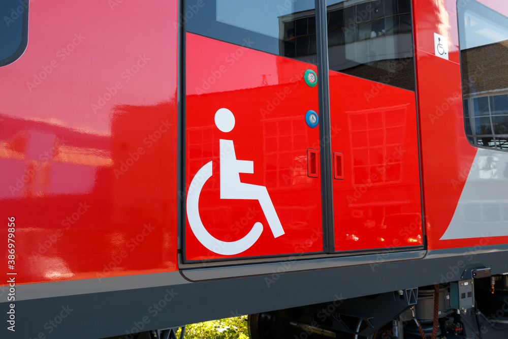 Sign disabled person on the carriage of a passenger train, closeup ...
