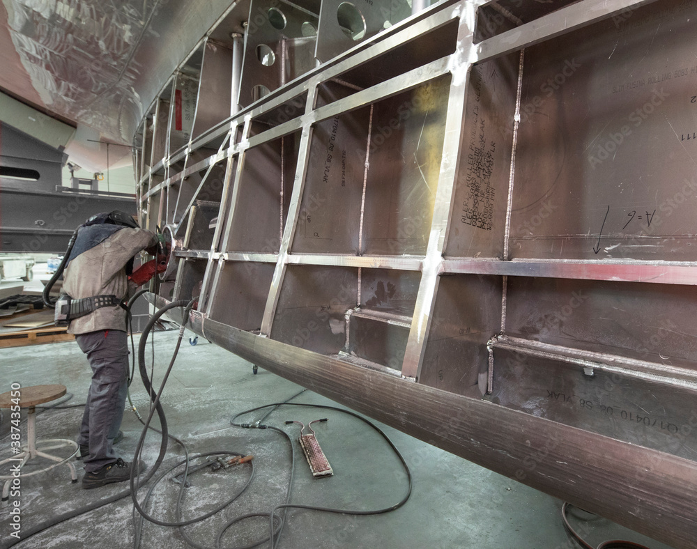 Sharpen. Keel. Aluminium hull of a super sailing yacht. Shipyard. Aiur ...