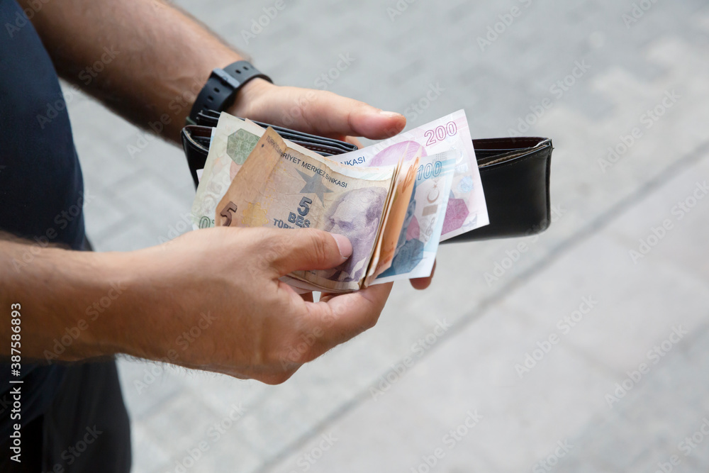The man who took money out of his wallet Stock Photo | Adobe Stock