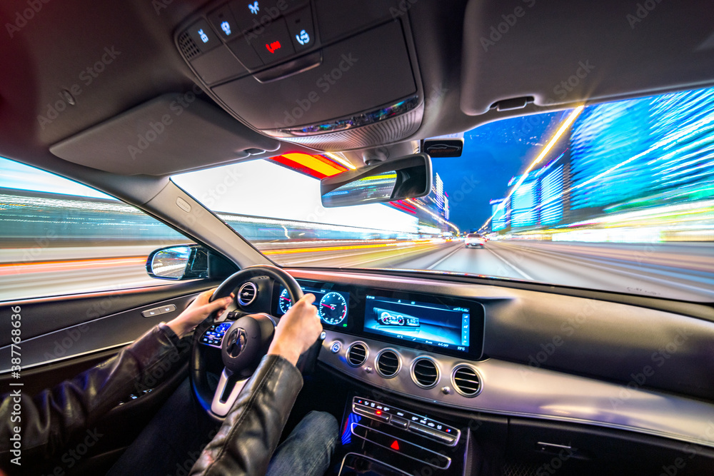 Movement of the car at night at high speed view from the interior with ...