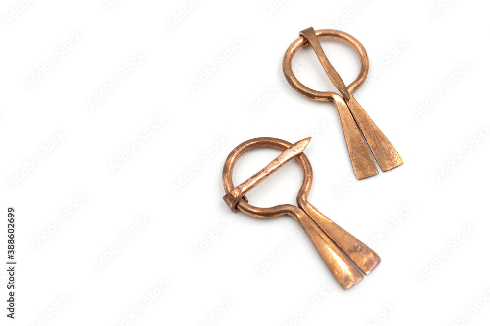 Isolated photos of a medieval copper fibula Stock Photo | Adobe Stock