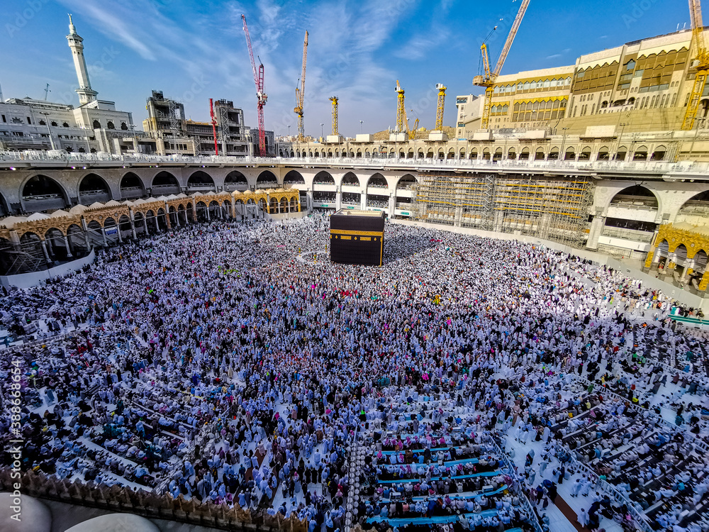 Muslim pilgrims from all around the World revolving around the Kaaba in ...