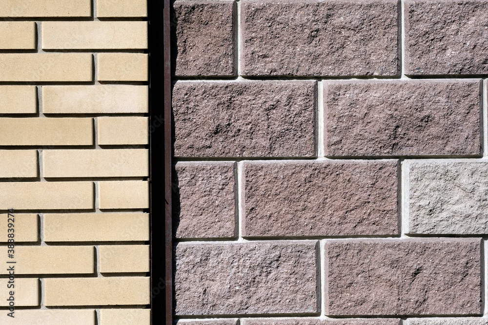 Wall with facing bricks. Different types of bricks on the facade of the ...