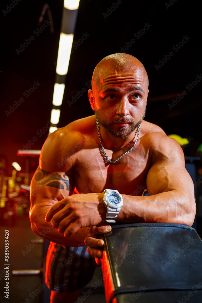 Strong, adult, fit, muscular male trainer posing for a photo shoot in ...