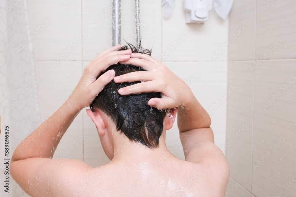 Hygienic procedures and healthy habits of a preteen boy - taking shower ...