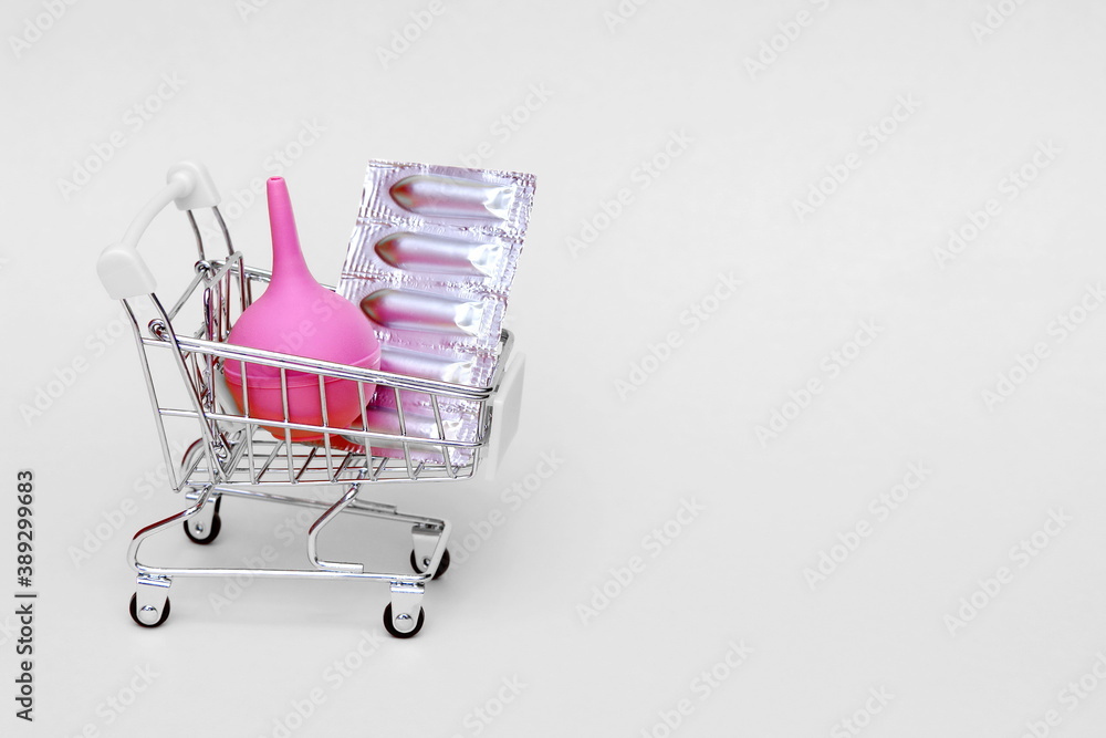 Medical suppositories in a silver blister pack and a pink rubber ...