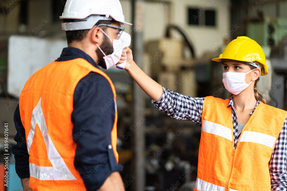 Temperature measurement with employee temperature meter before entering ...