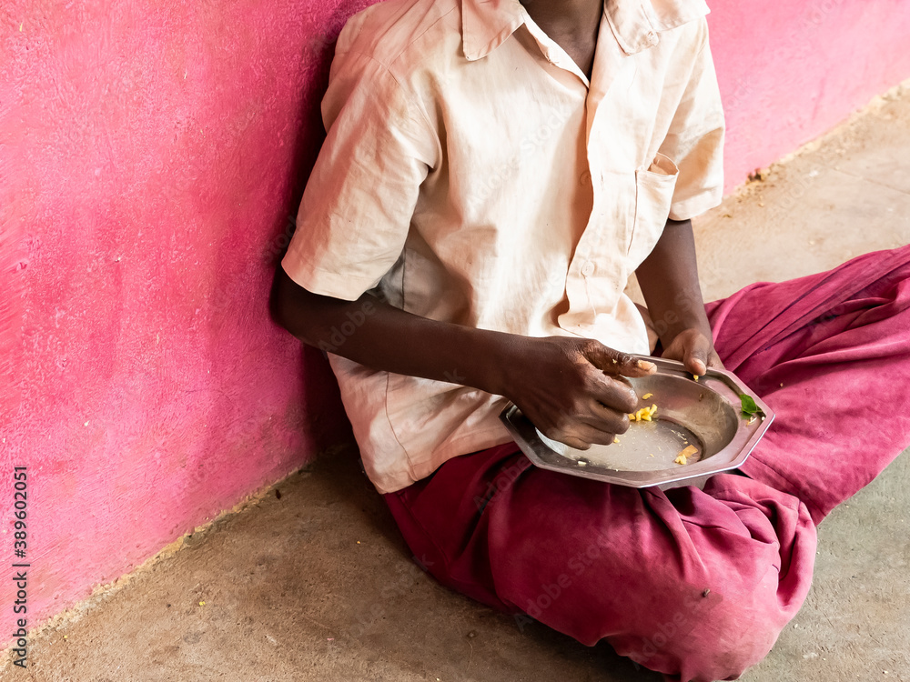 Unidentified poor classmates children with uniforms sitting on the ...