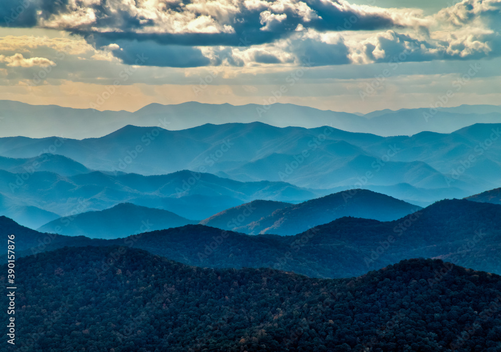 A wide landscape of the Blue Ridge Mountain layers with clouds in HDR ...