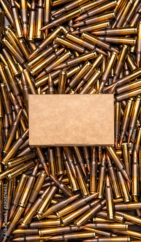 Background from cartridges for a carbine. A box of cartridges ...