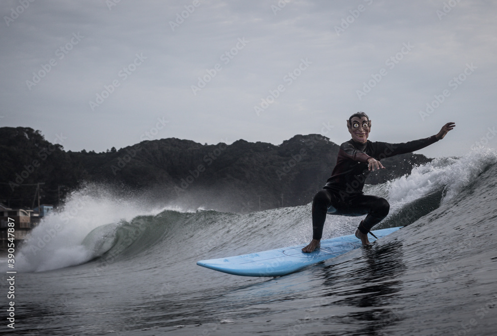 Halloween Costume Surfing Various scary costumes worn by a surfer while ...