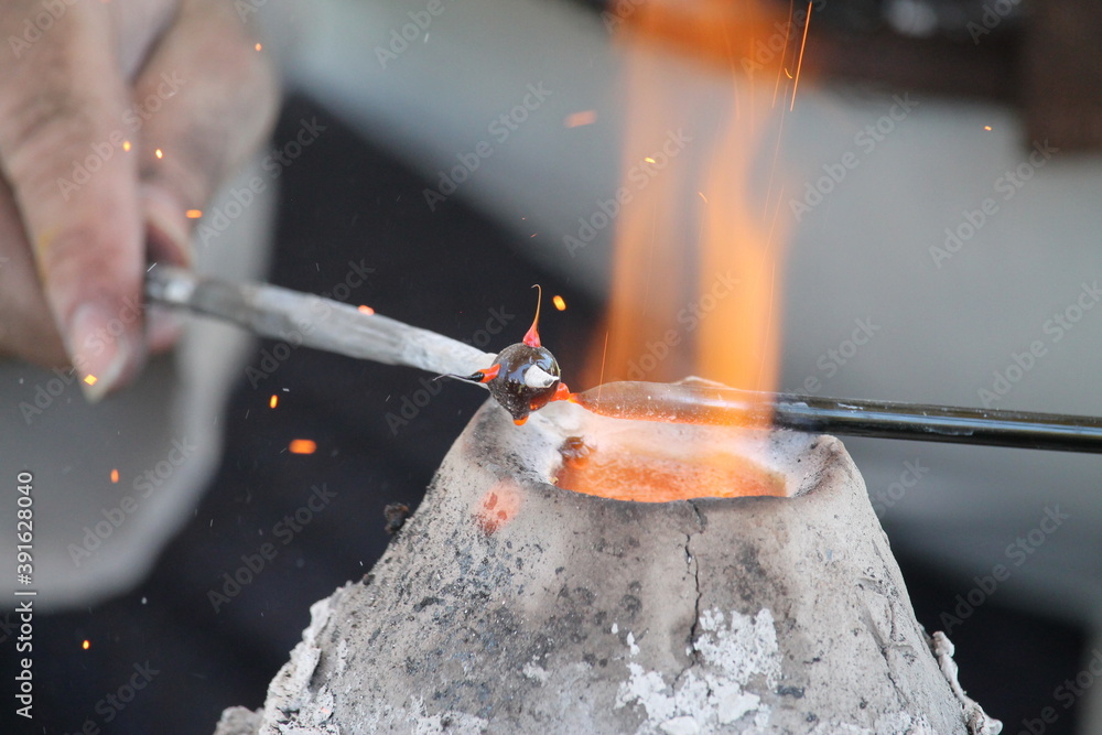 Bead making over a medieval kiln reproduction Stock Photo | Adobe Stock