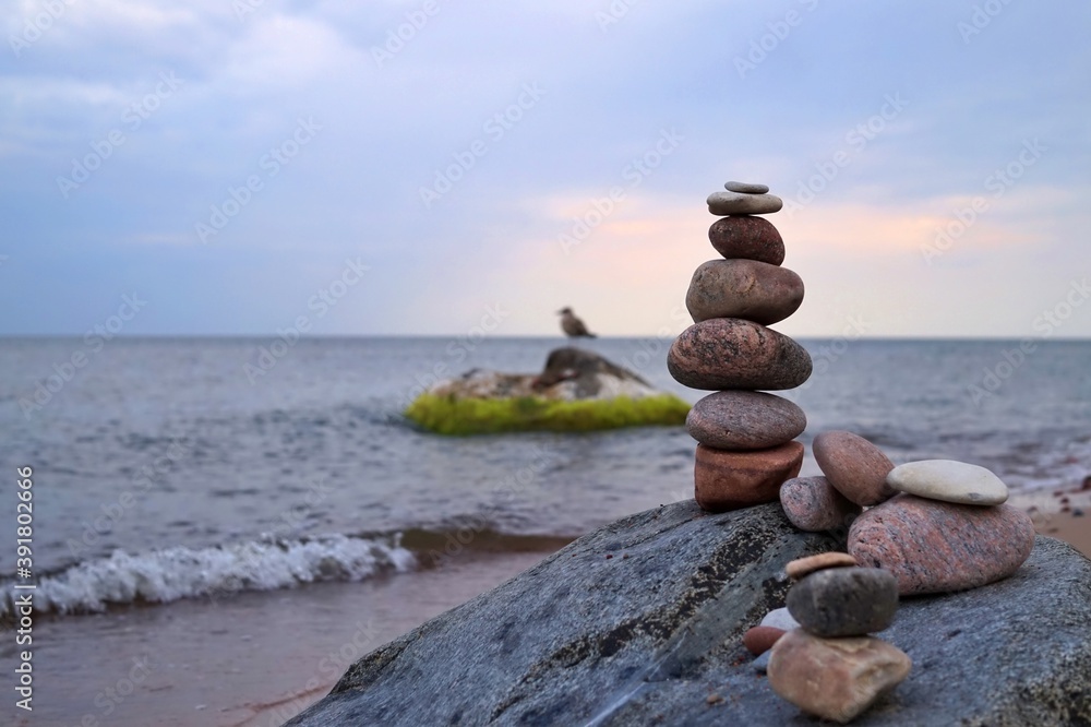 Balanced stack of stones or rocks on a beach Stock Photo | Adobe Stock