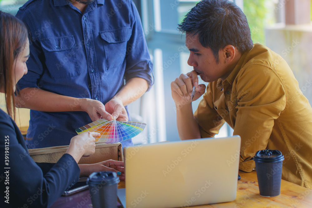 Team designer working graphic packaging design with color chart and ...