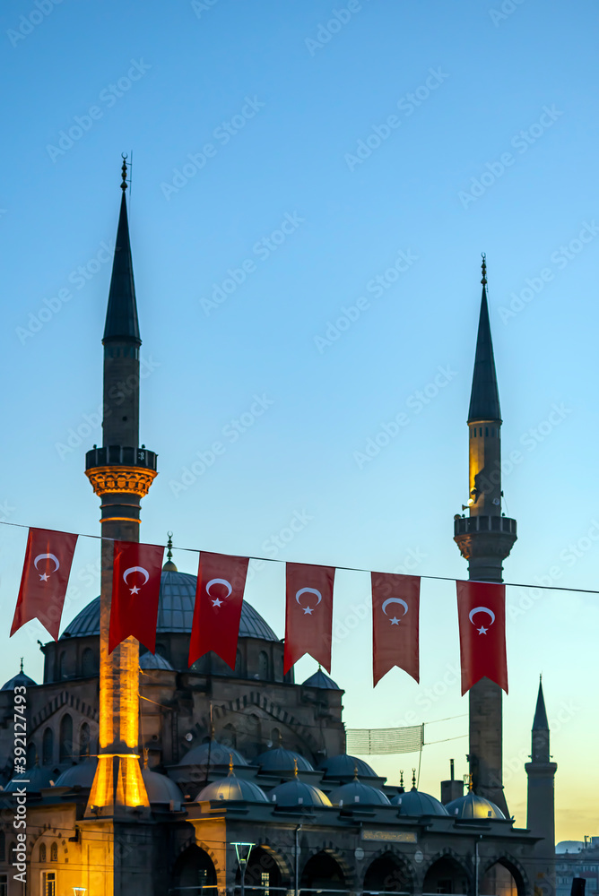 Mosque and Turkish flag skyline at sunset, vertical, In kayseri city ...