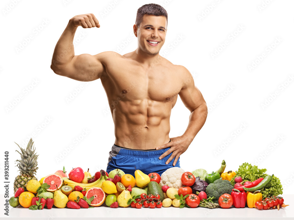 Topless muscular man showing flexing biceps muscle and posing with a ...