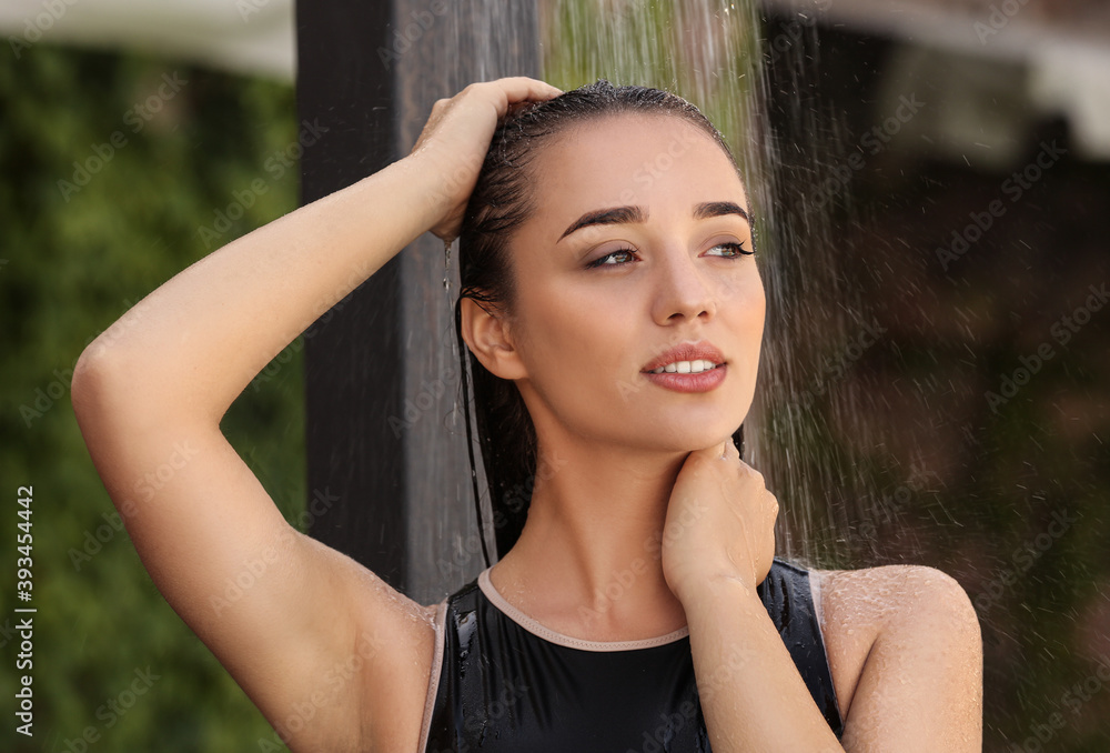 Woman washing hair in outdoor shower on summer day Stock Photo | Adobe ...