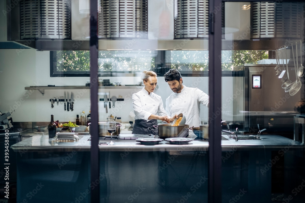 Professional chefs cooking in kitchen together Stock Photo | Adobe Stock