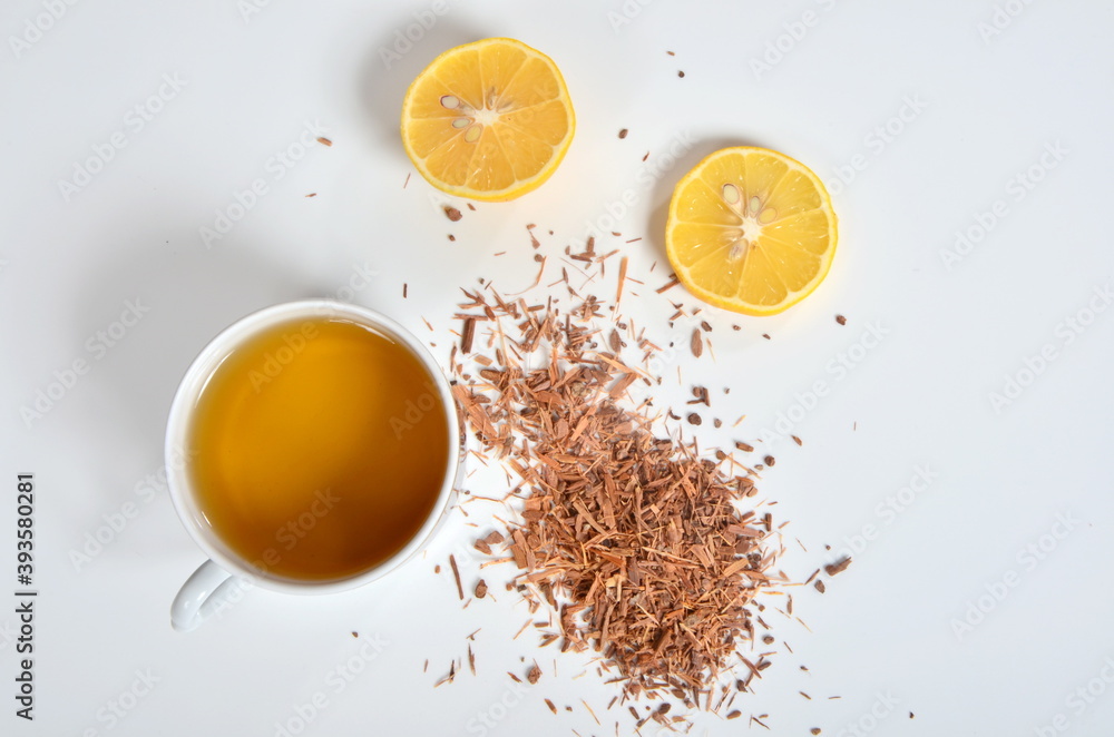 Cup of tea, Catuaba bark and lemon on white background. Natural herbal ...