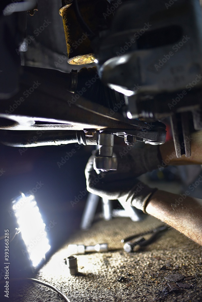Stock-Foto „replacement car front axle lower ball joint using pneumatic ...