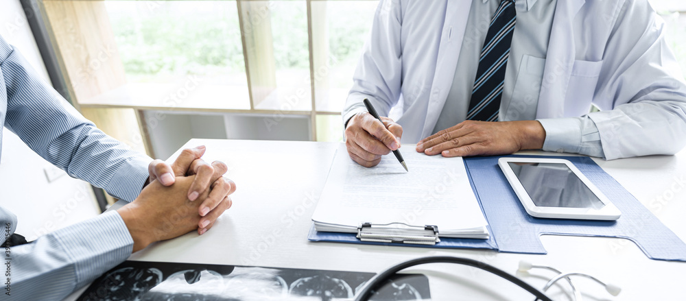 Professor Doctor consulting with patient discussing something and ...