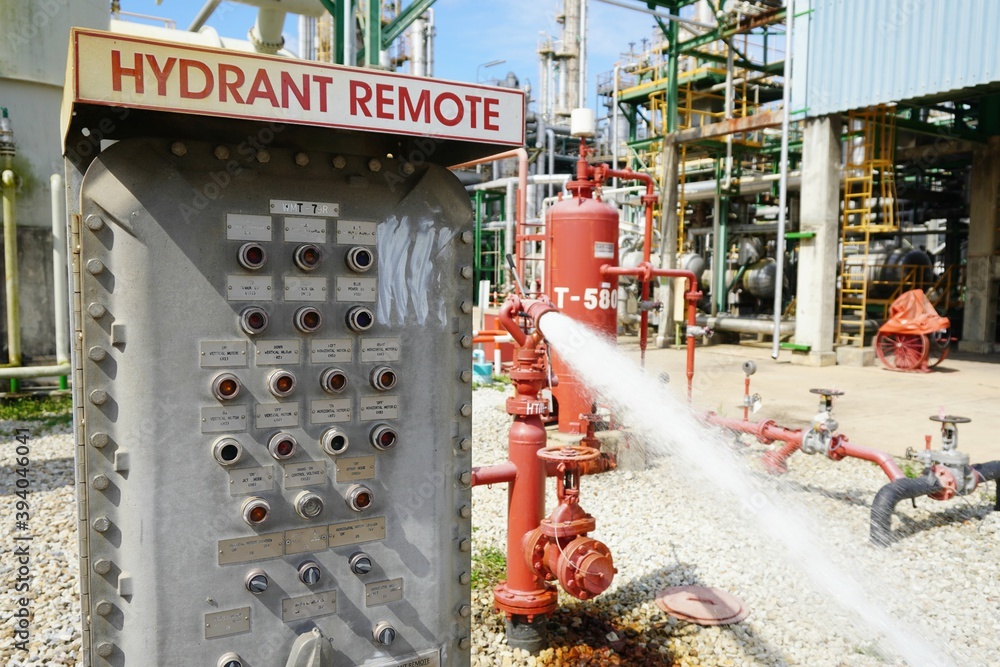 Water flowing vigorously from open fire hydrant as part of the fire ...