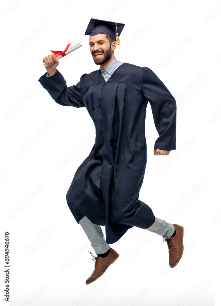 education, graduation and people concept - happy smiling male graduate ...
