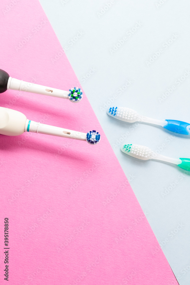 Heads of Two Professional Electric Toothbrushes Against Manual Brushes ...