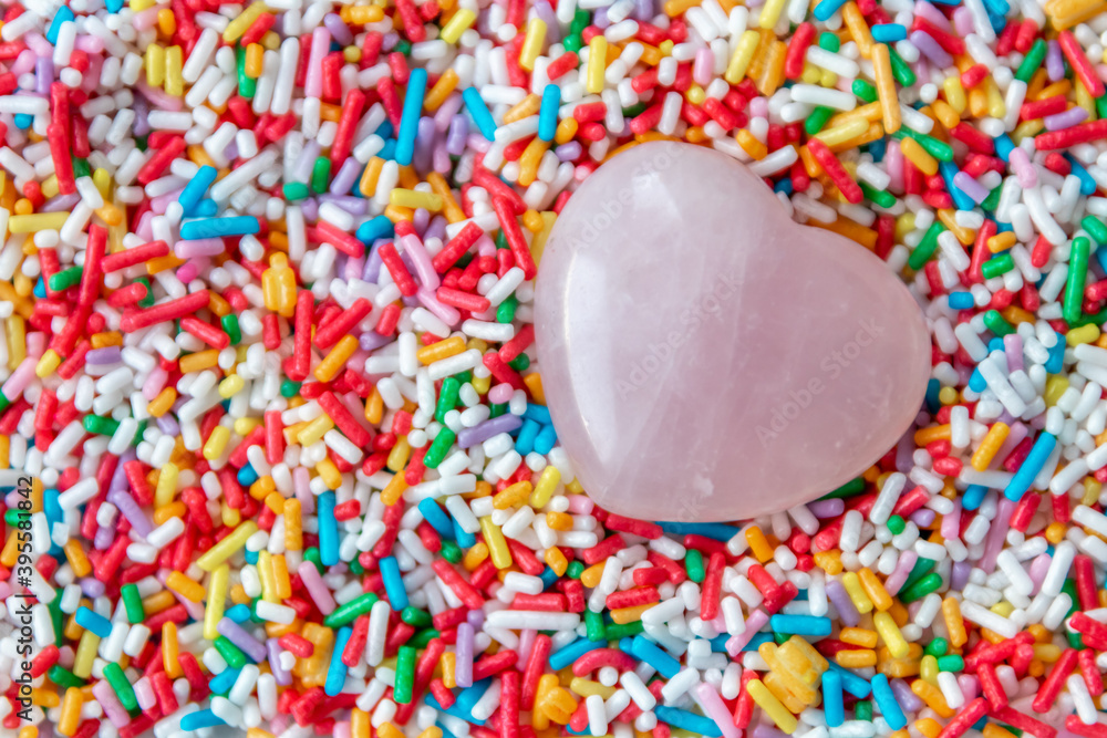 Heart on many colorful sprinkles as delicious decoration or birthday ...