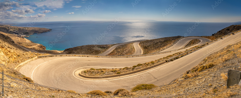 Breathtakingly steep and curvy roads climbing the coastal cliffs of the ...