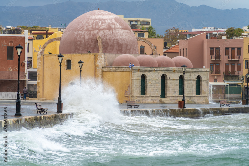 Storm flooded sea front streets of Kasteli, the of town of Chania, the ...