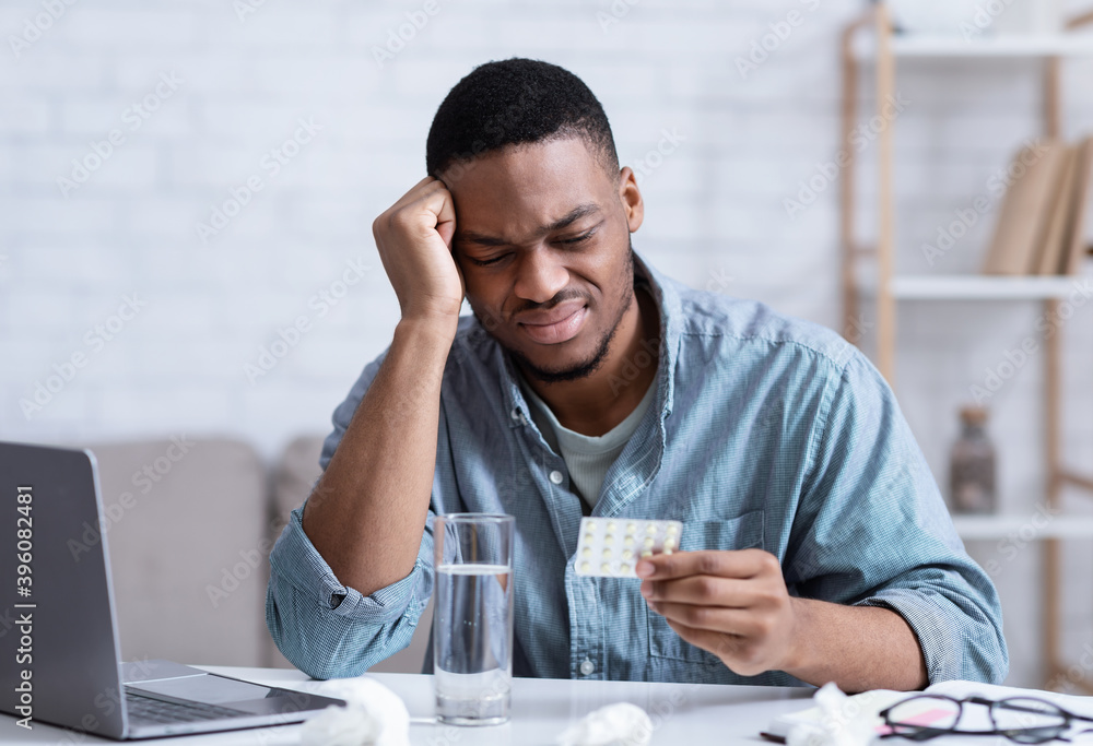 African Man Suffering From Headache Reading Pills Instruction At ...