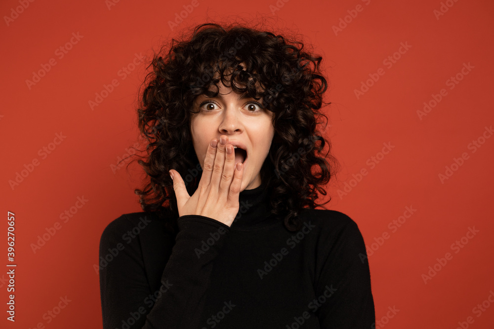 Portrait of shocked stupefied young female looks with widely opened ...