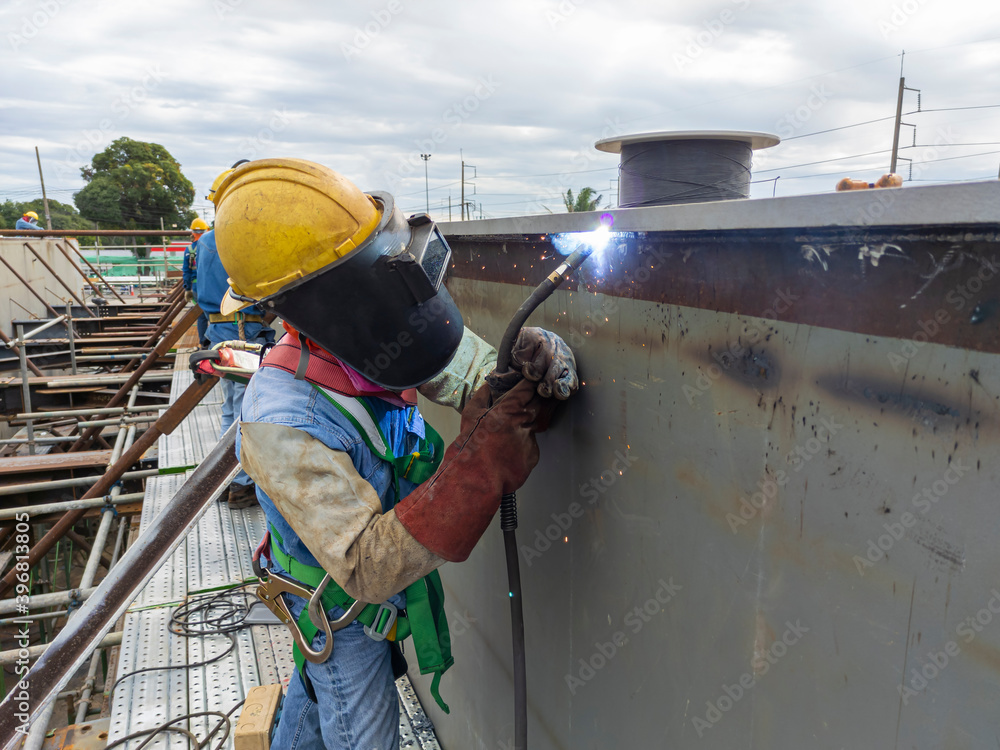 Photo Stock The welder is welding a steel structure work with process ...