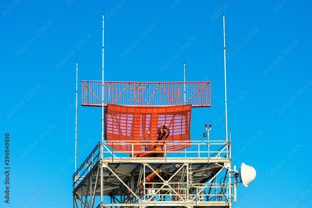 Fotografie Airport surveillance radar. The curving lower reflector and ...