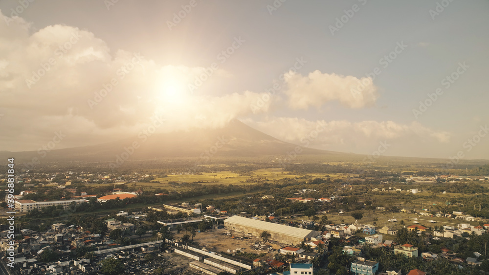 Sun shine over Mayon volcano erupt at Legazpi cityscape aerial. Epic ...