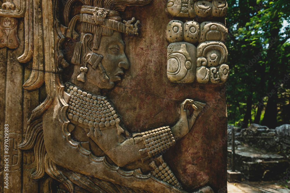 Detail of Basrelief carving of Mayan king at the archaeological site of ...