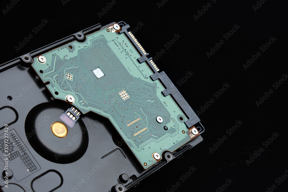 HDD drive front angle horizontal bottom view black background. Green ...