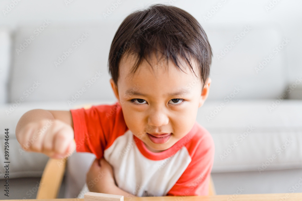 Angry kid.Little asian boy looking at his mother and fighting with mom ...