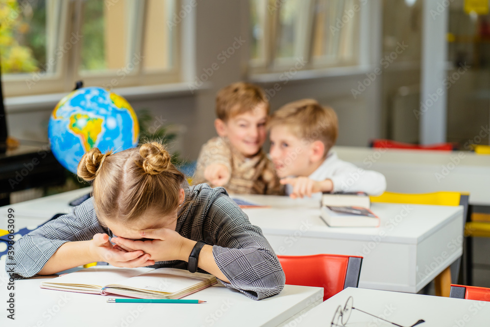 Stressed school girl child, pupil, bullying victim being by classmates ...