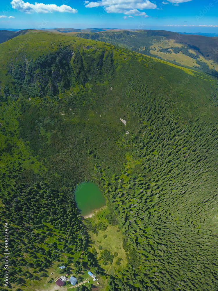 Aerial drone panorama of Iezerul Sureanu glacier lake and one mountain ...