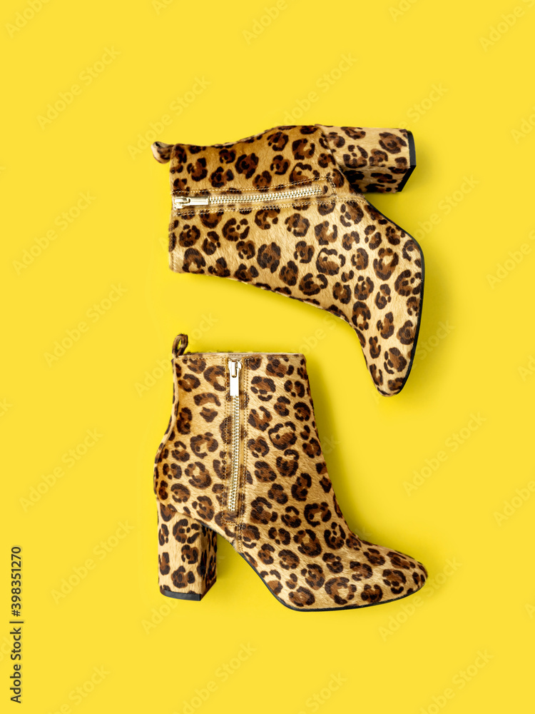 Flat lay shooting of catchy female boots with high heels and leopard ...
