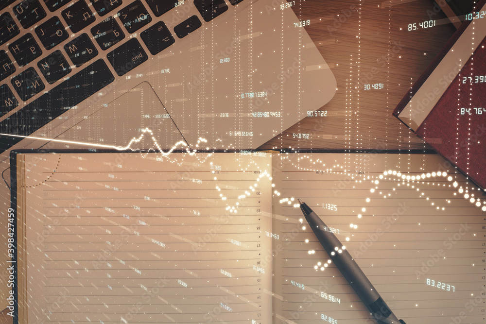 Stock market chart and top view computer on the table background ...