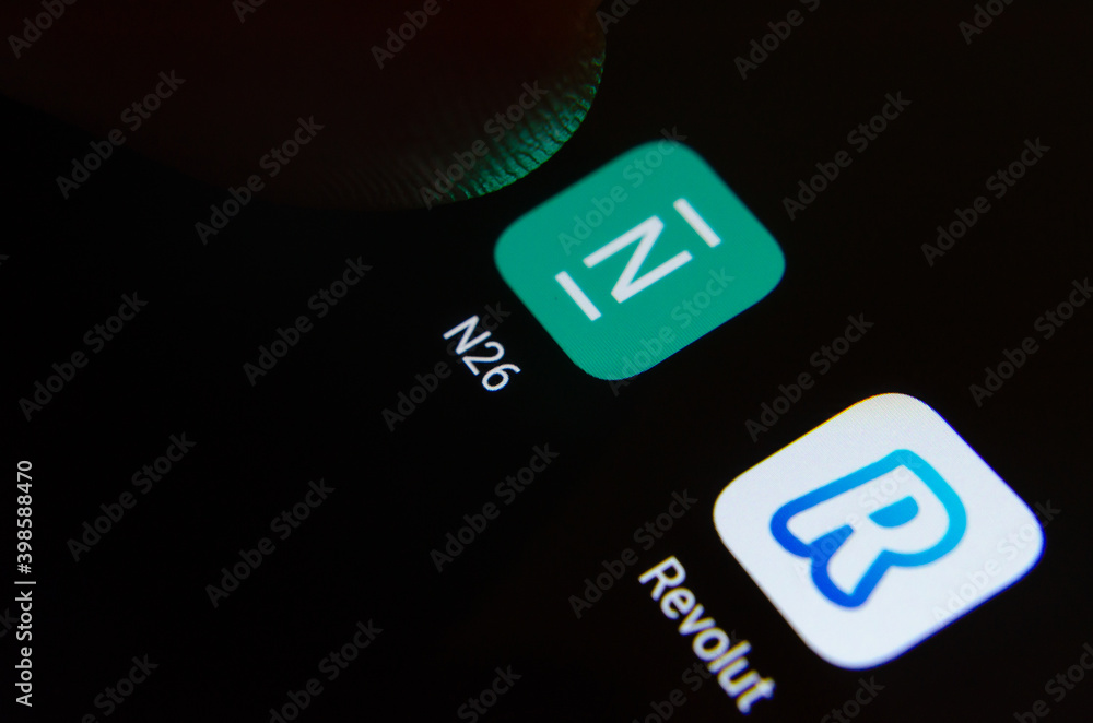 N26 and Revolut bank apps logo on the screen and a finger touching one ...