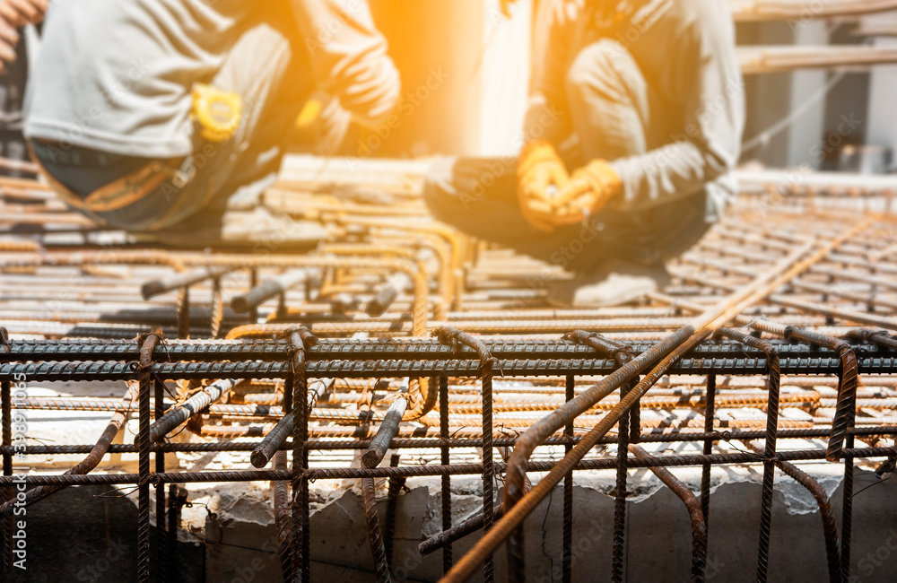 worker and reinforcement steel rod and deformed bar with rebar at ...