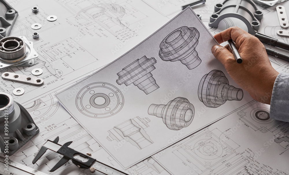 Engineer technician designing drawings mechanical parts engineering ...