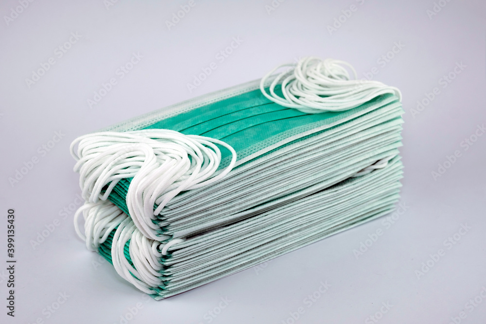 100 antivirus surgical face masks with ear loops isolated on white ...